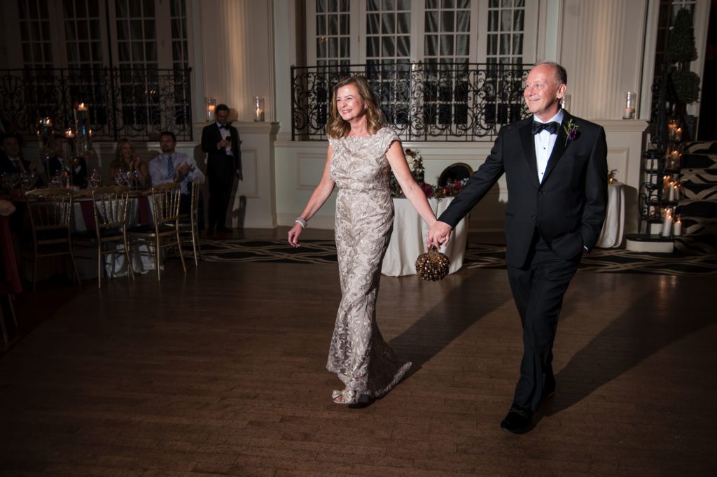 A man and woman walking down the aisle at a New York wedding reception ...